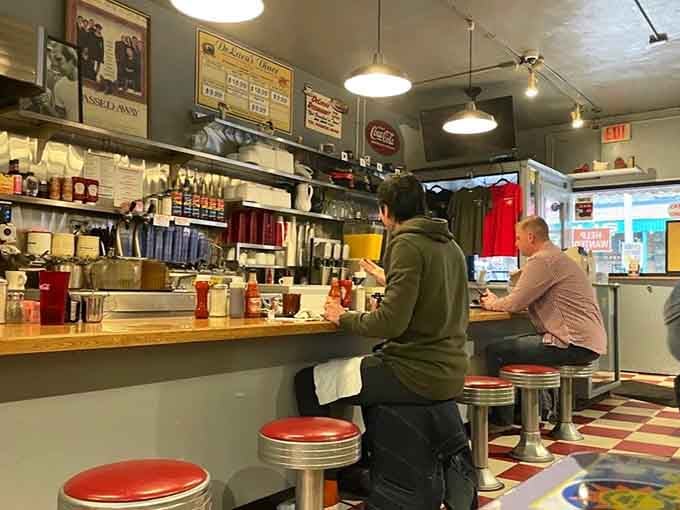 The counter where regulars hold court and newcomers quickly learn why this place has survived decades.