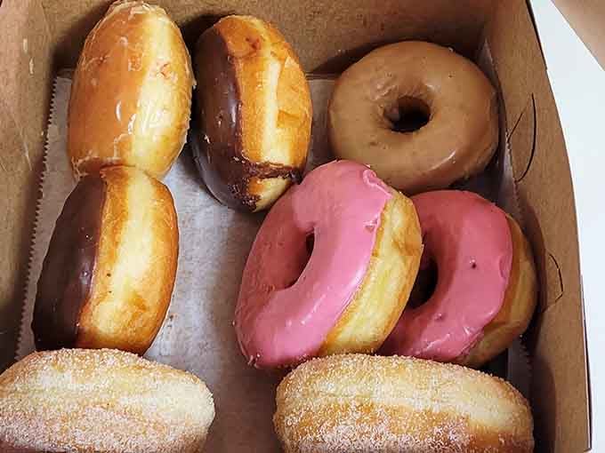 A mixed dozen showing off the beautiful variety, from pink-glazed stunners to cinnamon-sugar classics that never disappoint.