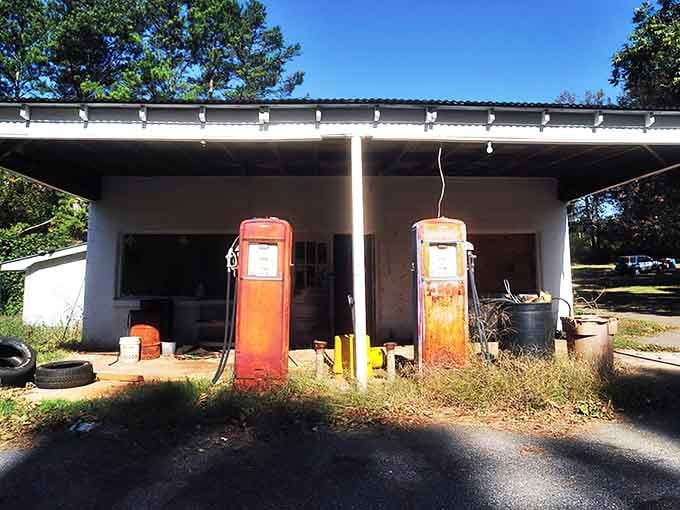 Those vintage gas pumps stand like rusty sentinels from an era when full-service actually meant something special.