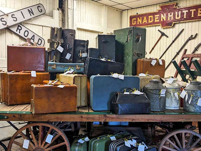 Vintage luggage stacked on this cart evokes the countless farewells and hopeful reunions that happened on these very platforms.
