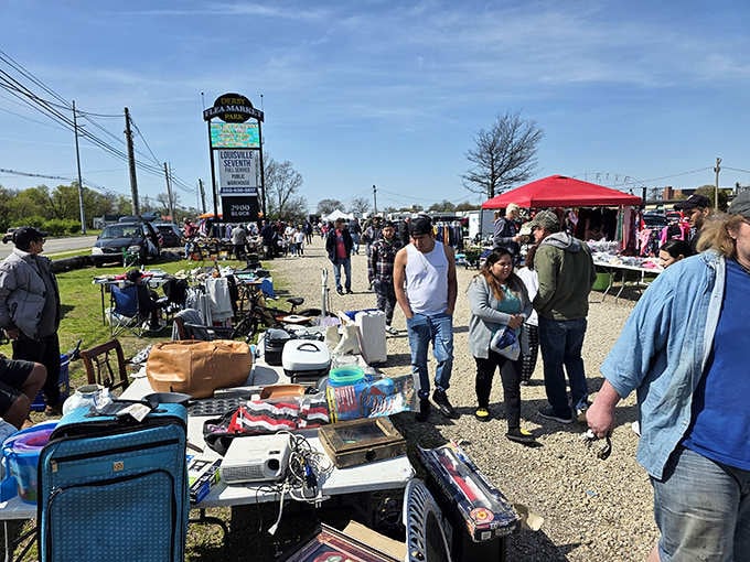 Crowds browsing outdoor vendors on a perfect day, proving that treasure hunting is Louisville's favorite weekend spectator sport.