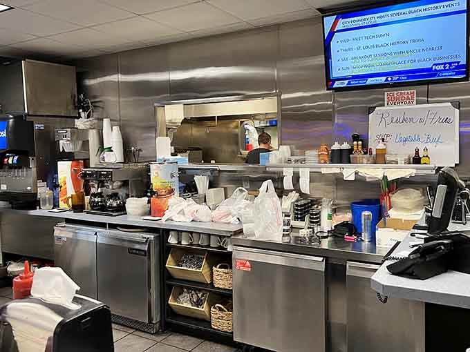 The open kitchen where you can watch your meal being prepared with practiced efficiency and care.