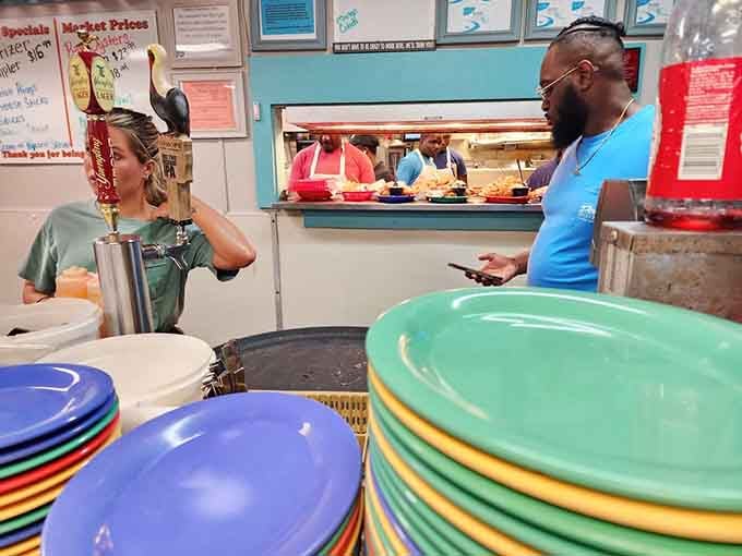Stacks of colorful plates at the ready mean this kitchen stays busy feeding hungry seafood lovers all day long.