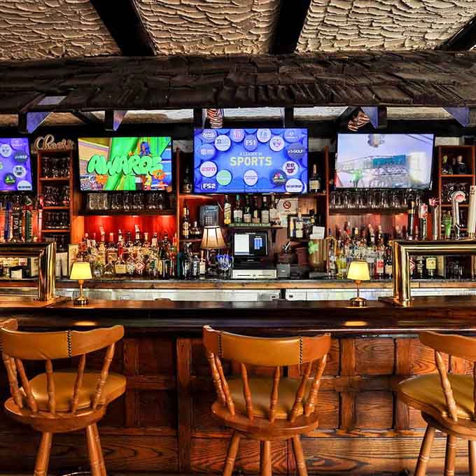 The bar where locals gather, sports play overhead, and everyone knows this is their happy place.