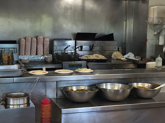 The open kitchen where decades of burger magic happens, with fresh ingredients ready for their delicious transformation ahead.