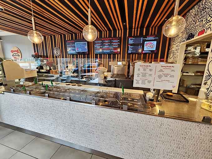 Modern lighting fixtures hang above the ordering area like edible halos guiding you toward pie-based salvation and happiness.