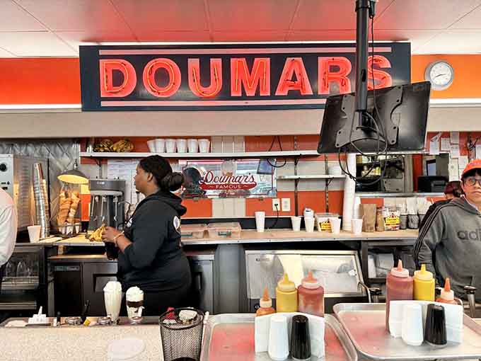 The counter where magic happens, with staff keeping century-old traditions alive one hand-rolled cone at a time.