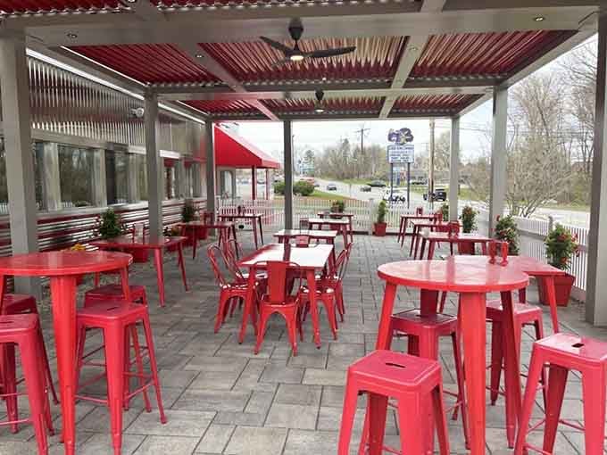 Red patio furniture so cheerful it makes eating outside feel like a perpetual summer celebration.