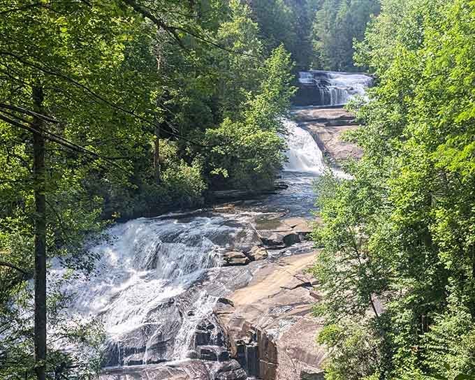 Framed by summer foliage, multiple cascades tumble downward like nature decided one waterfall simply wasn't enough for this spot.