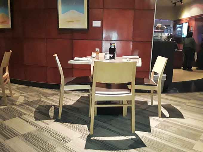 Comfortable booths line the dining room, providing strategic vantage points for planning your next buffet run.