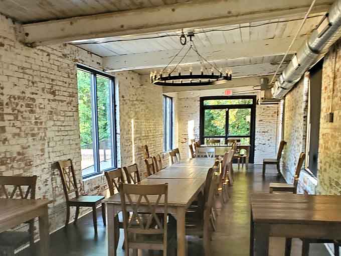 Exposed brick and natural light create dining spaces where you can actually hear your conversation partner without shouting.