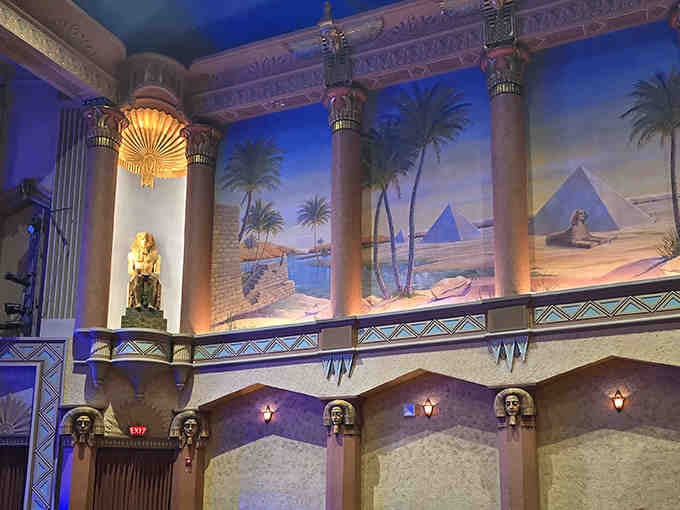 The Sphinx would approve of these towering columns and sunburst motifs flanking the atmospheric walls.