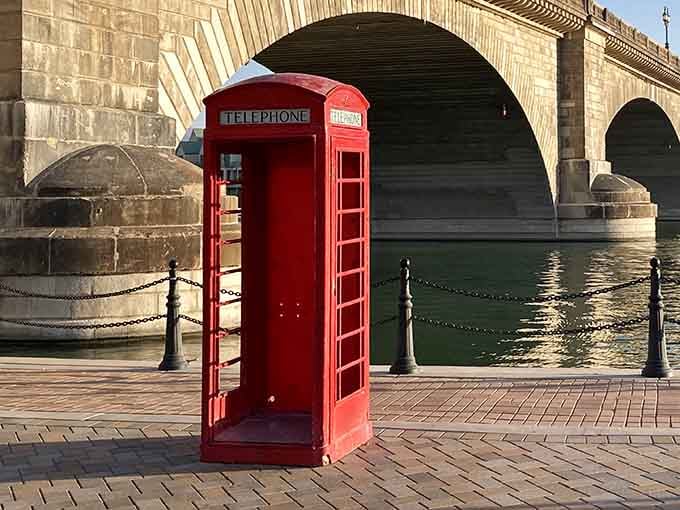 A classic red telephone booth stands ready for photos, though nobody remembers how actual phone booths worked.