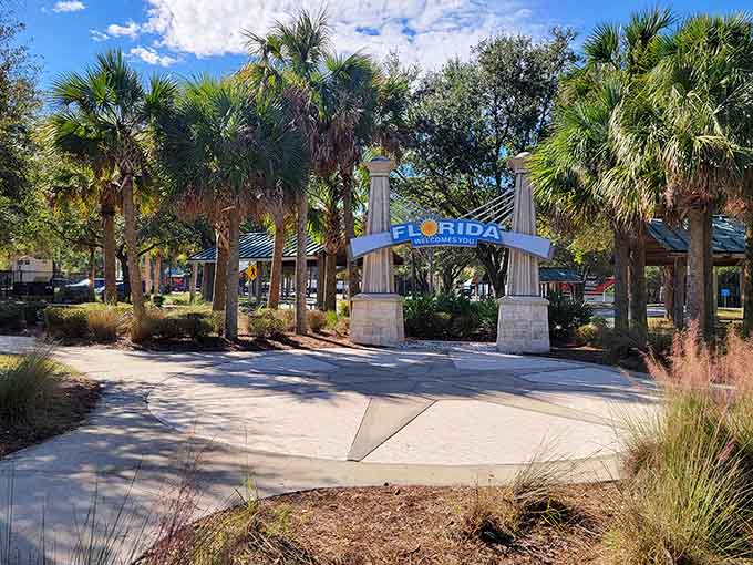 The fancy archway entrance tries hard, but that simple blue sign still steals the show every time.