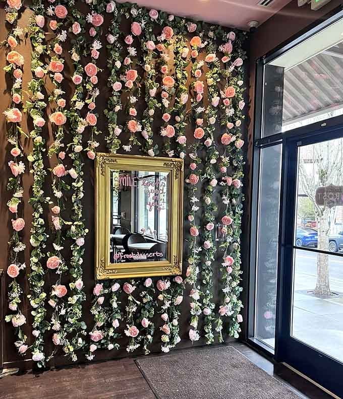 A flower wall so Instagram-worthy that your brunch might get cold while you're taking photos, but honestly, it's worth it.