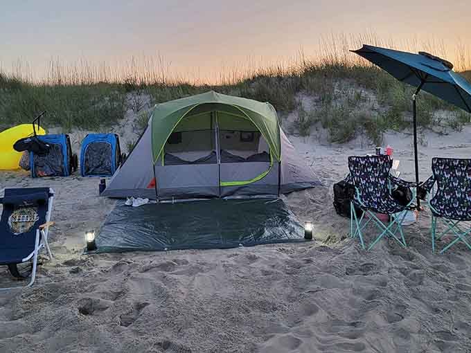 Beach camping at sunset transforms a simple tent into prime oceanfront real estate that no developer can ever touch or ruin.