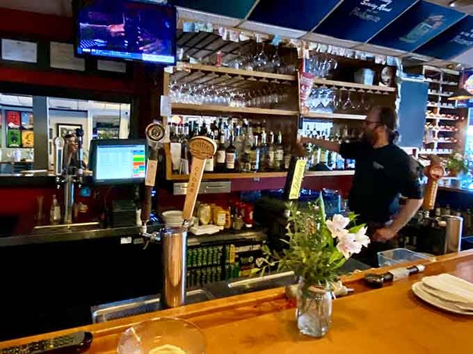 Fresh flowers on the bar and tap handles at attention, this is where neighborhood hospitality meets serious craftsmanship.