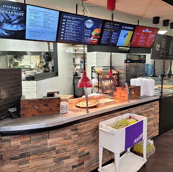 The ordering station where friendly staff take your requests and the open kitchen ensures freshness you can see.