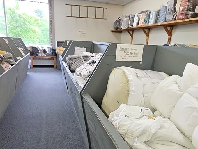 Mattress covers and bedding supplies organized in bins, because even your foam needs proper protection from life's little accidents.