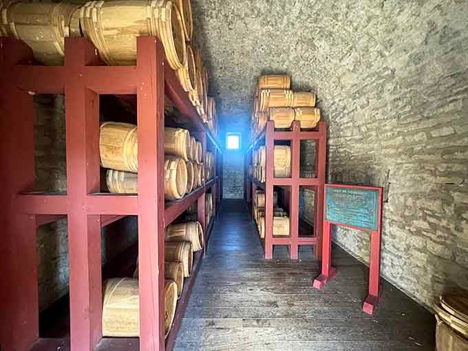 The powder magazine interior shows wooden storage racks where barrels of gunpowder once sat, making this the fort's most important room.