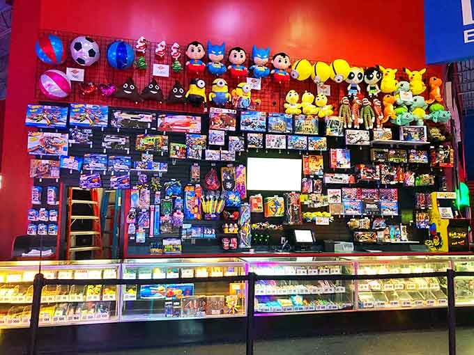 That prize wall is basically a museum of everything you never knew you desperately needed until this exact moment.