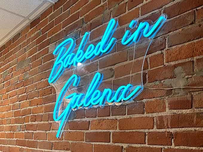 That electric blue neon against exposed brick is like finding a jukebox in a library: unexpected and absolutely perfect.