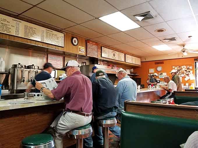 The counter crowd at breakfast time: where regulars gather, newspapers rustle, and the coffee flows like a warm, caffeinated river.