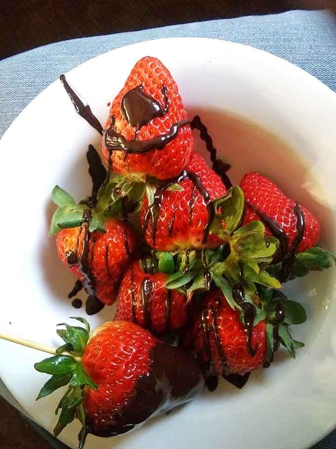 Chocolate-drizzled strawberries at a buffet? Now we're talking fancy without the fancy price tag attached.