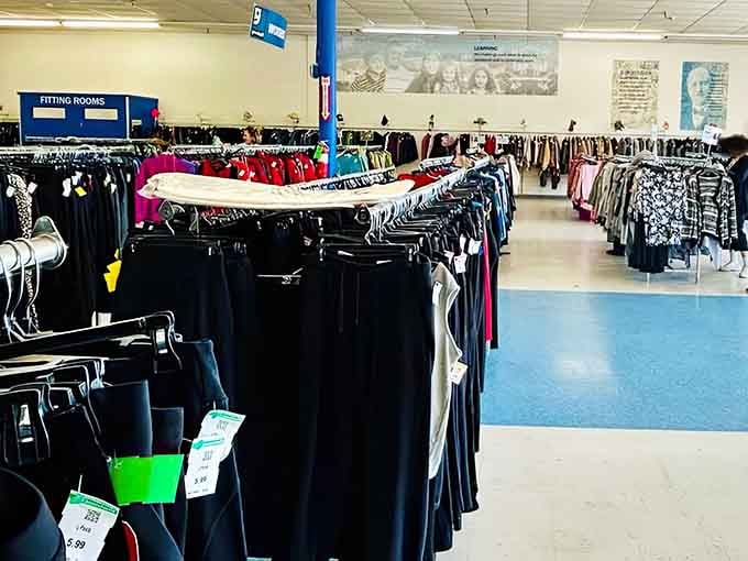 Clothing racks extend into the distance like a fabric horizon, each hanger holding potential wardrobe transformation possibilities.