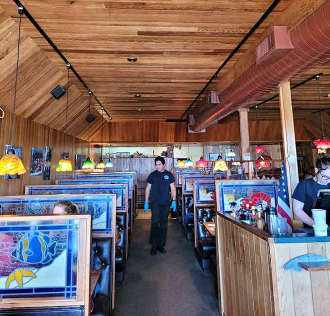 The friendly staff navigating the dining room with practiced ease, making everyone feel like a regular customer.