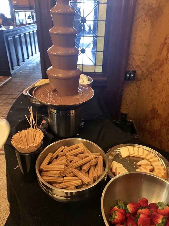 The chocolate fountain surrounded by strawberries and graham crackers is pure childhood joy, upgraded.