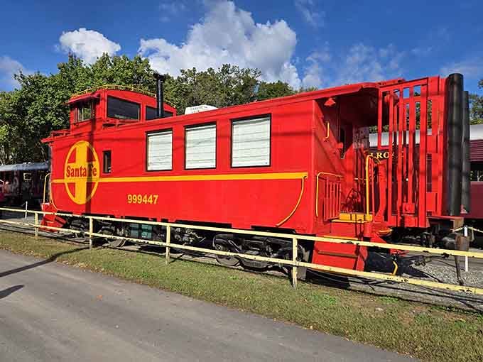 The bright red caboose sits proudly on display, a reminder of when train crews actually rode at the back.