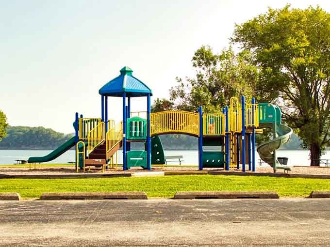 A playground with a lake view means the kids are entertained while you enjoy scenery that doesn't involve cartoon characters.