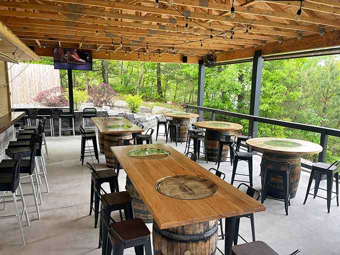 The bar area features unique whiskey barrel tables where you can enjoy a pre-dinner cocktail in style.