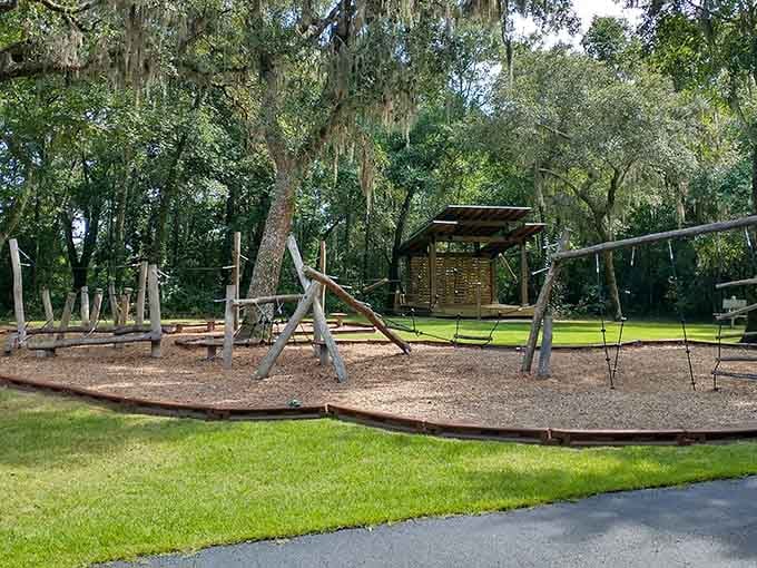 Shaded play areas under live oaks mean kids can burn energy while parents enjoy actual shade.