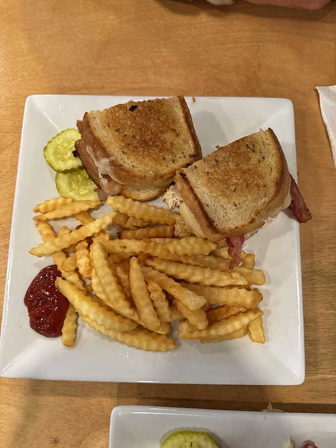 The tuna melt arrives golden and toasted, oozing with cheese like your favorite childhood lunch grew up fancy.