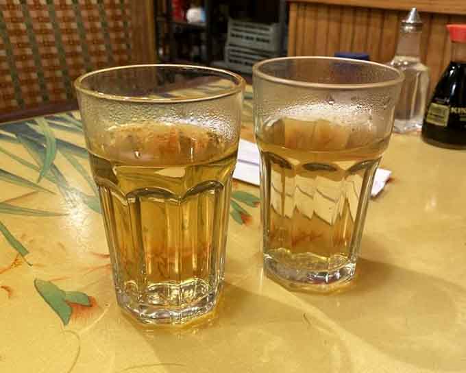 Complimentary barley tea, the unsung hero that cools your palate between bites of spicy, delicious adventure.