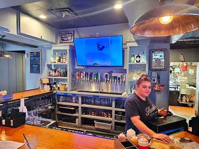 The bar area where cold drinks meet warm hospitality, and sports fans find their happy place among fellow enthusiasts.