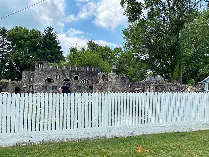 Behind the white picket fence, castle spires rise unexpectedly, making neighbors wonder if they missed the memo about backyard ambitions.