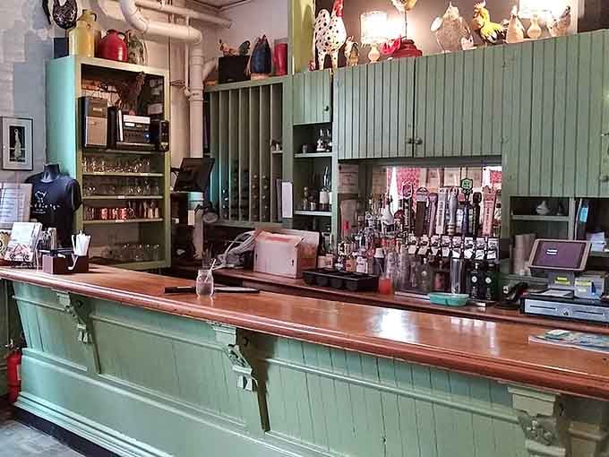 The bar area maintains that same welcoming vibe, where chicken-themed decor meets serious beverage craftsmanship with style.