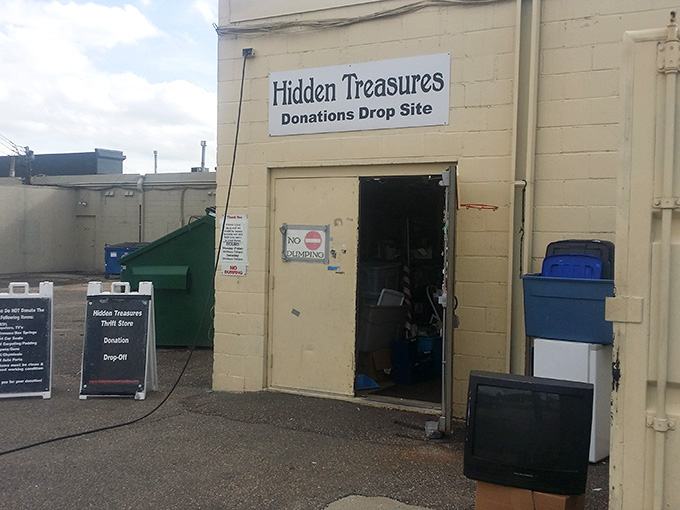 The donation drop-off area where your old treasures become someone else's new discoveries in this endless cycle.