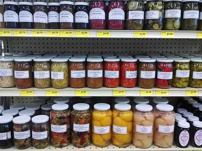 Shelves of preserved goods in every color imaginable, like a rainbow made entirely of pickles, peppers, and possibilities.