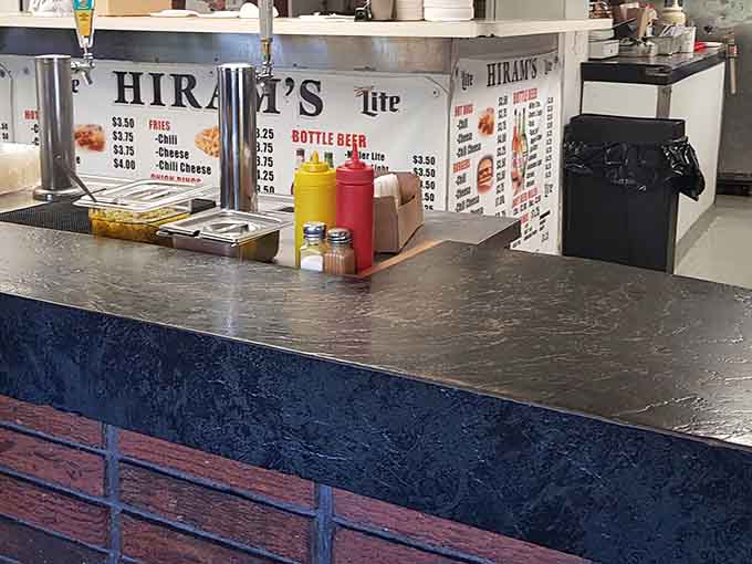 Classic squeeze bottles of ketchup and mustard standing ready like old friends at every single table.
