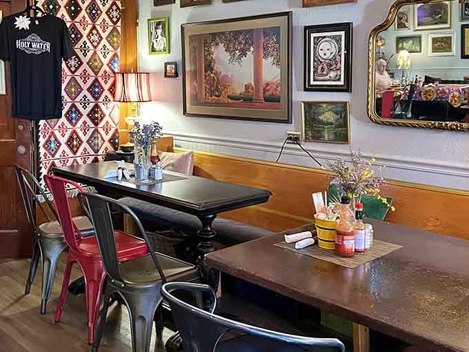 Vintage art meets mismatched chairs in a space that feels like your coolest relative's living room, only with better food.
