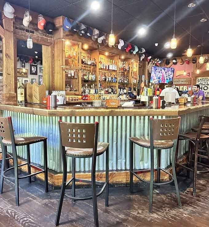 The bar area features corrugated metal and enough bourbon to make any barbecue experience even better somehow.