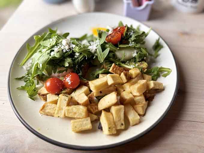 Fresh arugula salad with roasted tomatoes proves that even the lighter options get the same attention to quality and presentation.