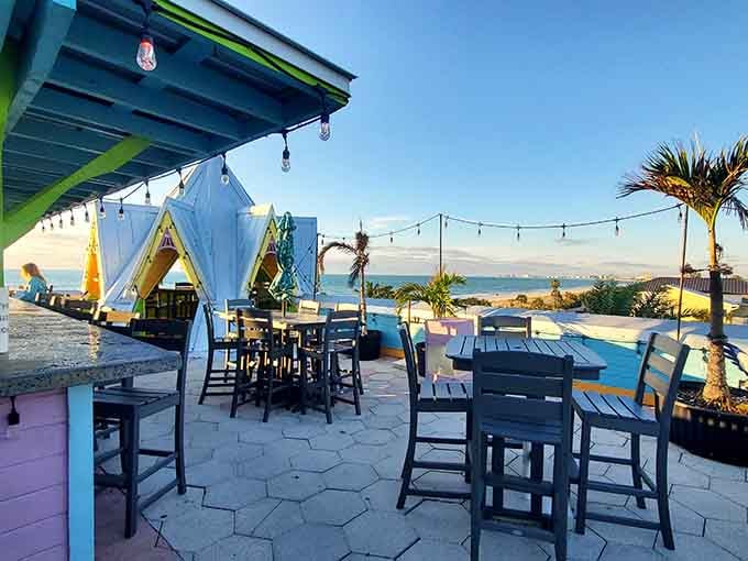 Colorful outdoor tables offer front-row seats to the Intracoastal Waterway's daily show of boats, birds, and beautiful sunsets.