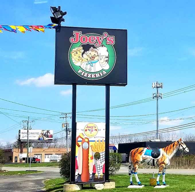 That pizzeria sign hints at Joey's expanded empire, because one location of greatness wasn't quite enough.