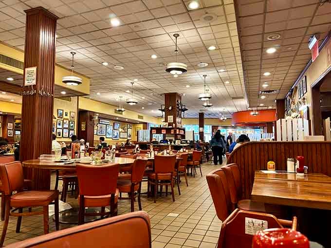 Spacious dining room with comfortable seating where strangers become friends over shared appreciation for good food and conversation.