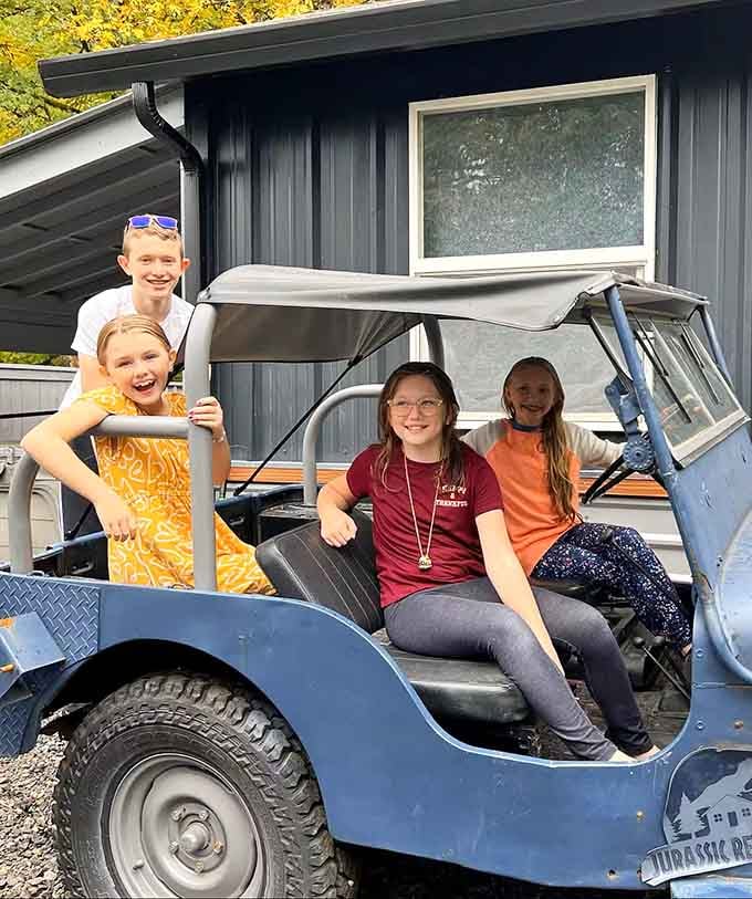 These happy adventurers in the Jurassic Park Jeep replica prove this place delivers pure joy for every generation visiting.